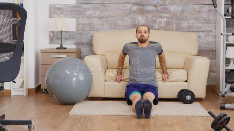 Dips training on sofa stock footage. Video of healthy - 186381590