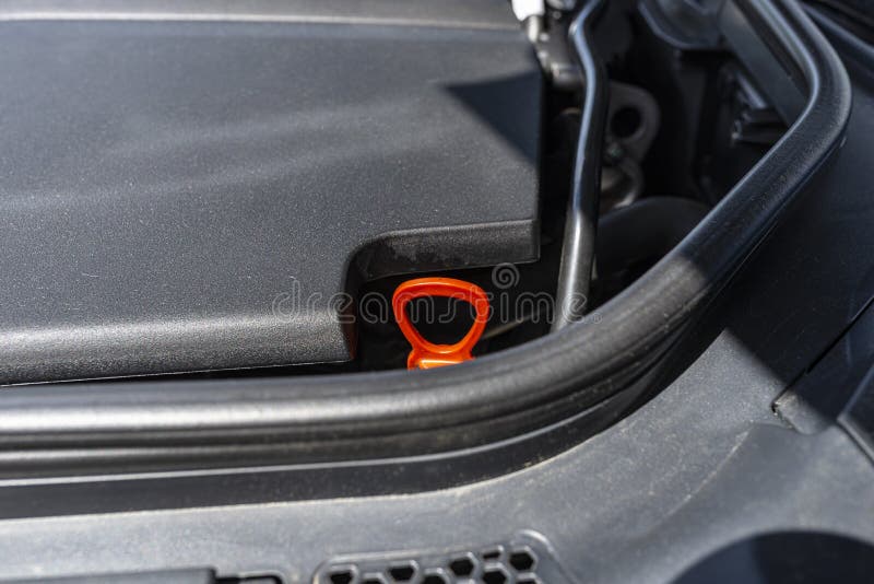 Dipstick for Checking the Oil Level in a Car Engine in Orange. Stock ...