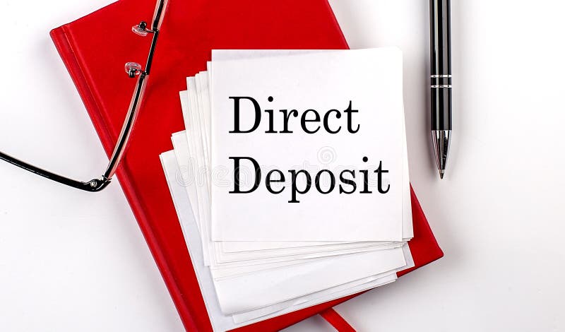 DIRECT DEPOSIT Text on Sticker on Red Notebook with Pen and Glasses ...