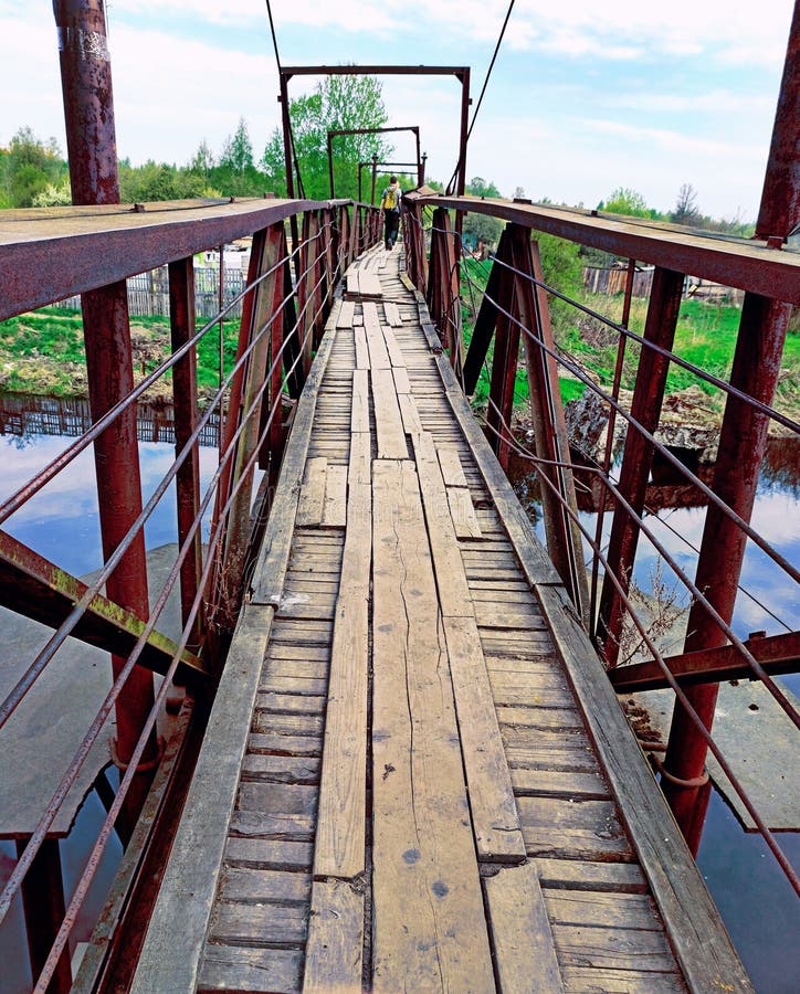 A Direct Way Forward Along an Old Rusty Narrow Metal Bridge with a ...