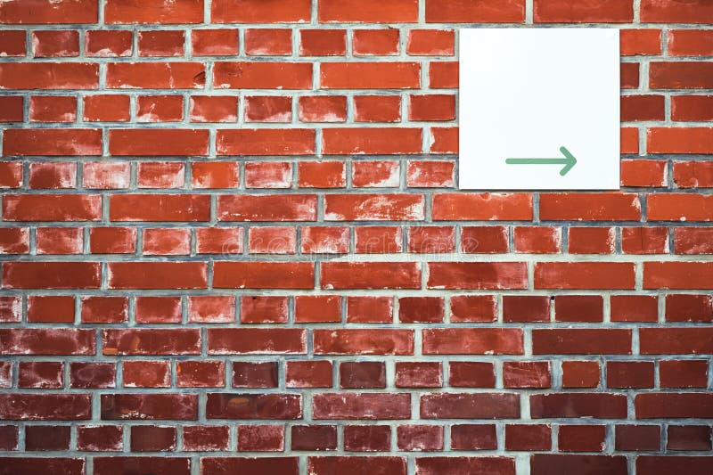 Direction Arrow Sign Board on Brick Wall Facade Stock Photo - Image of ...