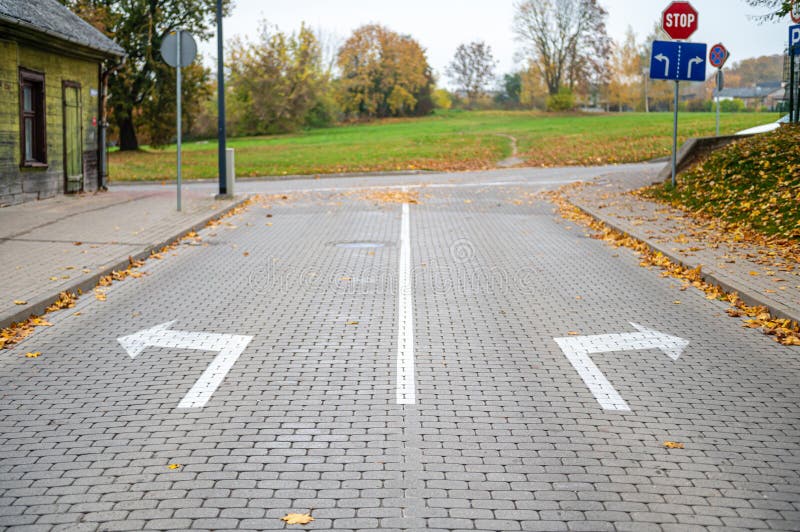 Direction Arrows on Paved Road at Intersection, Choice Concept Stock ...