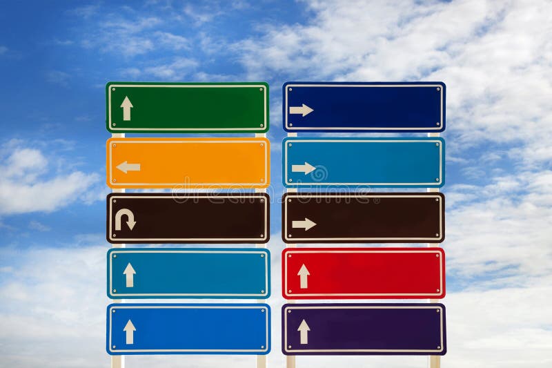 Direction Boards Stand Tall Against a Bright Blue Sky Stock Photo ...