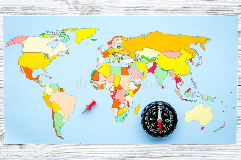 Direction Concept with Compass and Map on White Wooden Background Top ...