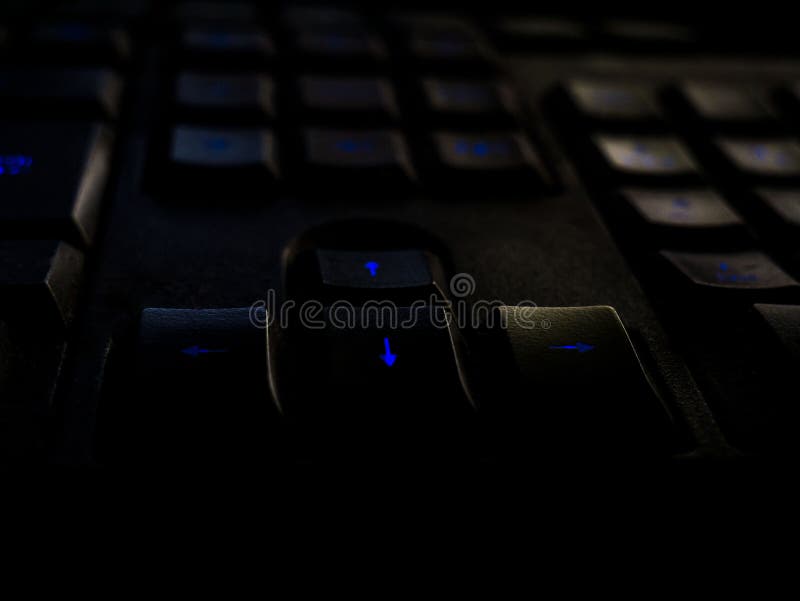 Direction Keys on the Keyboard Backlit in Blue in the Dark Stock Photo ...