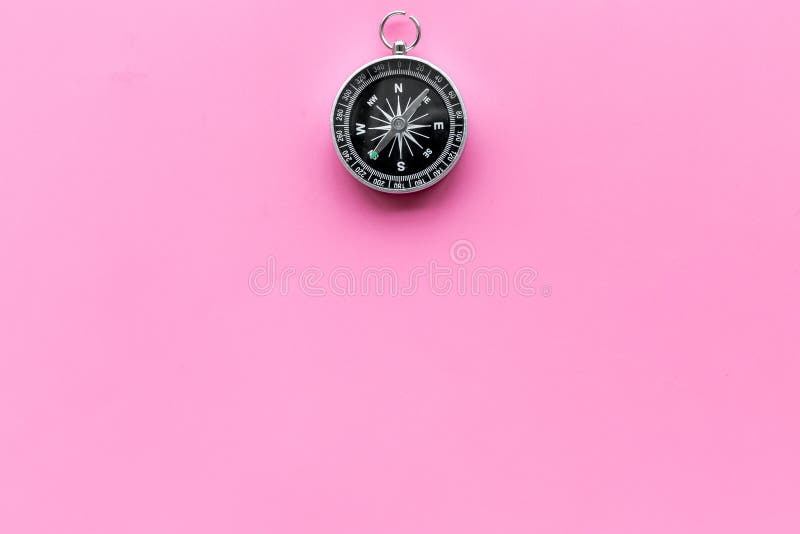 Direction of Movement. Compass on Pink Background Top View Copy Space ...