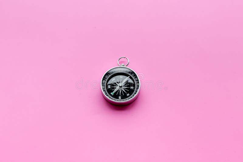 Direction of Movement. Compass on Pink Background Top View Copy Space ...