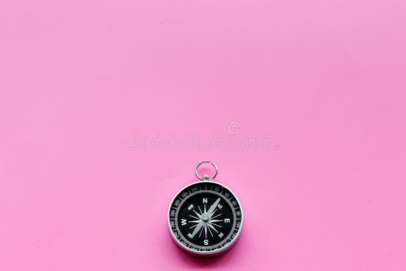 Direction and Movement Concept with Compass on Pink Background Top View ...