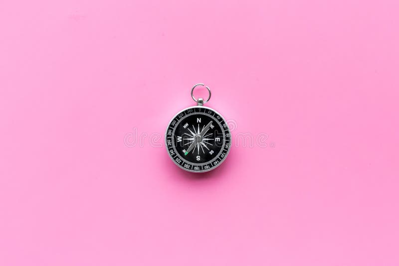 Direction and Movement Concept with Compass on Pink Background Top View ...