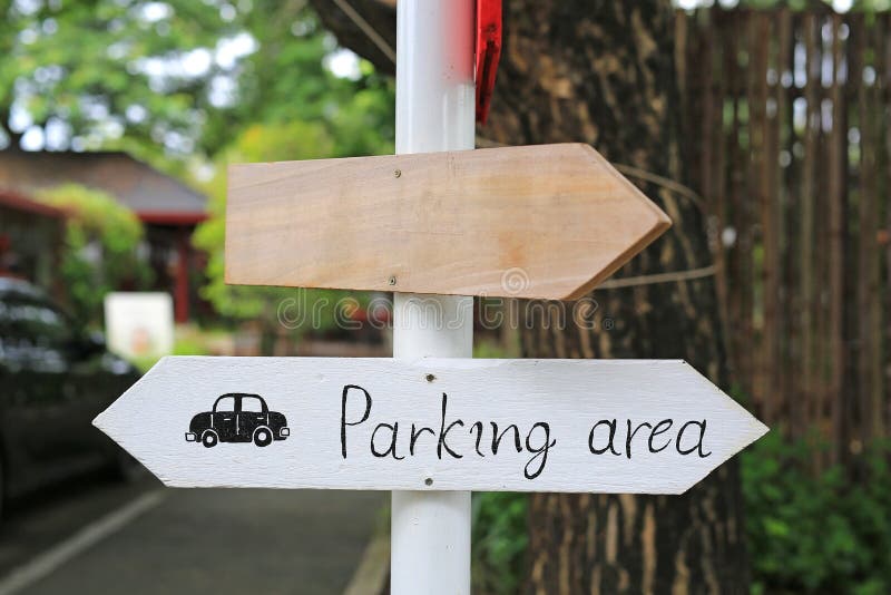 Direction Parking Area Sign on Wooden Panel with Arrow on the Pole ...