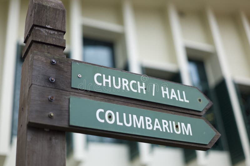 Direction sign in a Church stock photo. Image of arrow - 19364184