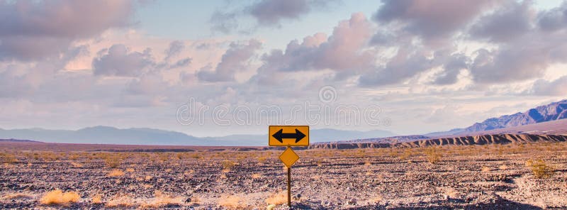 Direction Sign in the Desert Under a Blue Sky. Concept of Uncertain ...