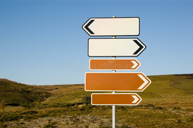 Crossroads with Confusing Directional Arrow Sign Stock Photo - Image of ...