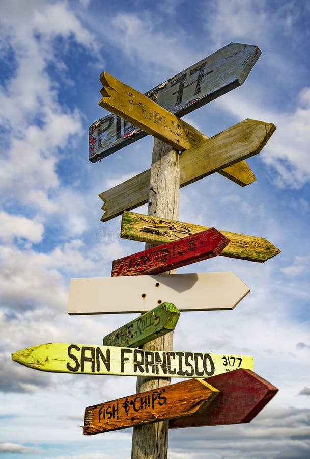 Direction Signs with Arrows on Blue Sky, Maine Stock Image - Image of ...