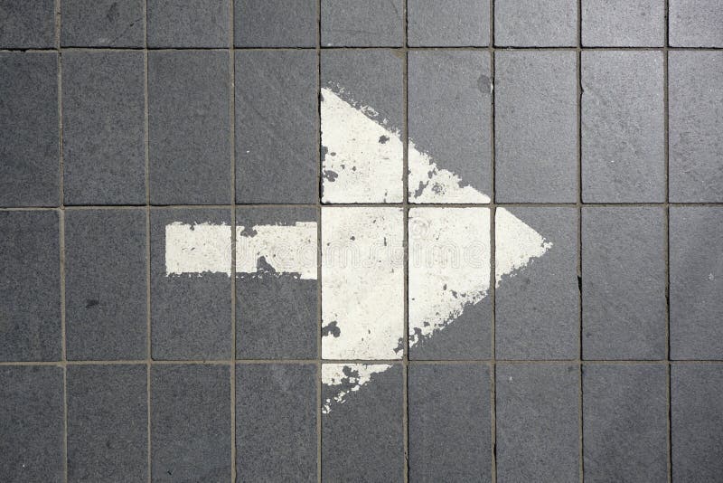 Directional Arrow Pointing Forward on an Empty Street Stock Image ...