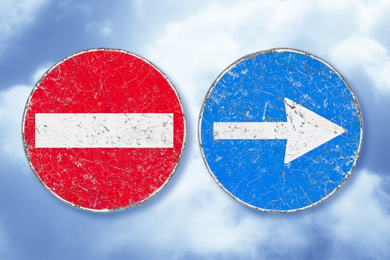 Directional Arrow Road Sign and No Entry Road Sign Against a Sky ...