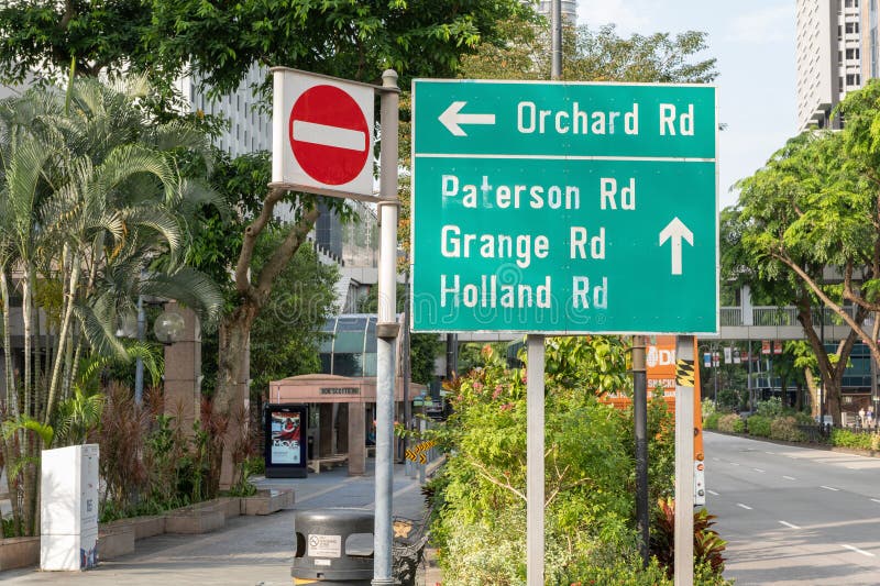 Directional Road Sign for Orchard Road in Singapore with Lush Greenery ...