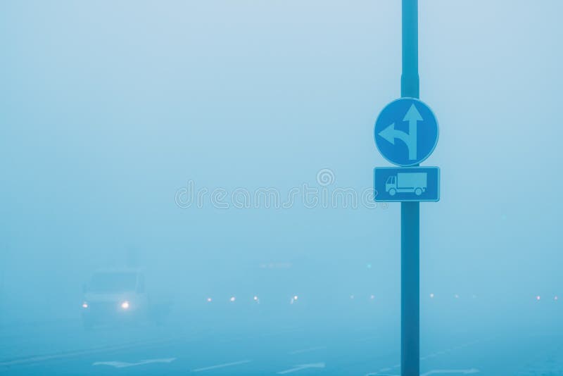 Directional Traffic Sign for Trucks in Fog Stock Photo - Image of ...