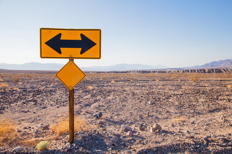 Directional Sign in the Desert with Scenic Blue Sky and Wide Horizon ...