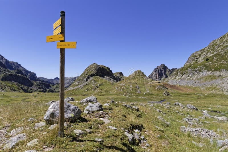 A Directions Post on Paths between Mountains Stock Photo - Image of ...