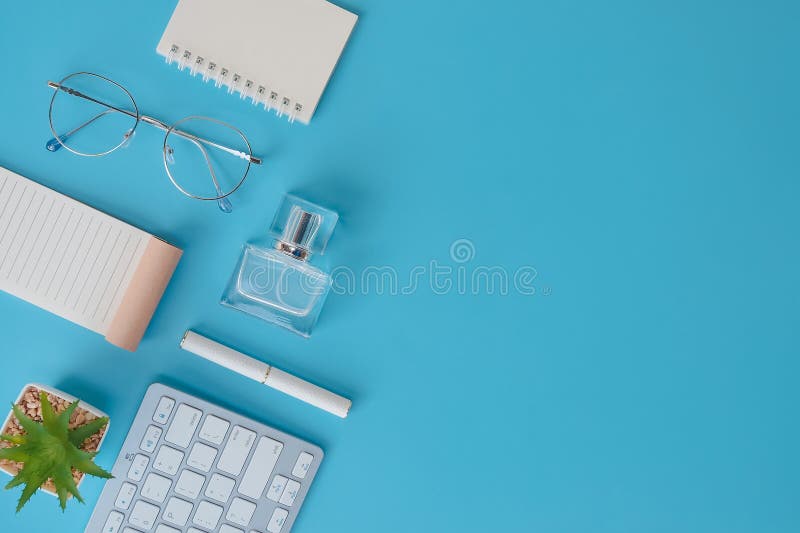 Directly Above of Office Table Desk with Keyboard on Blue Background ...