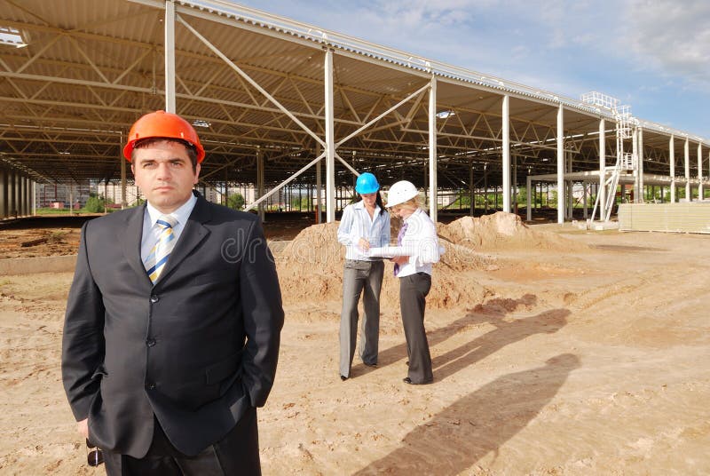 Director with Subordinates on Construction Site Stock Image - Image of ...