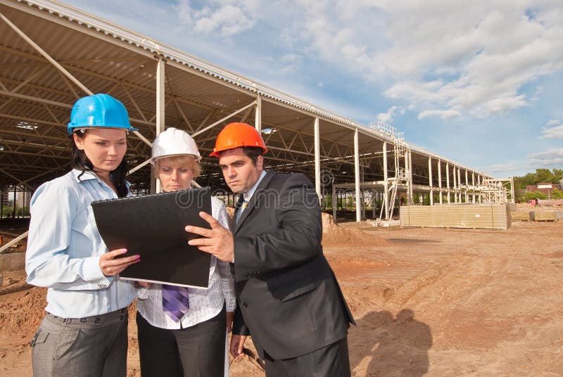 Director with Subordinates on Construction Site Stock Image - Image of ...