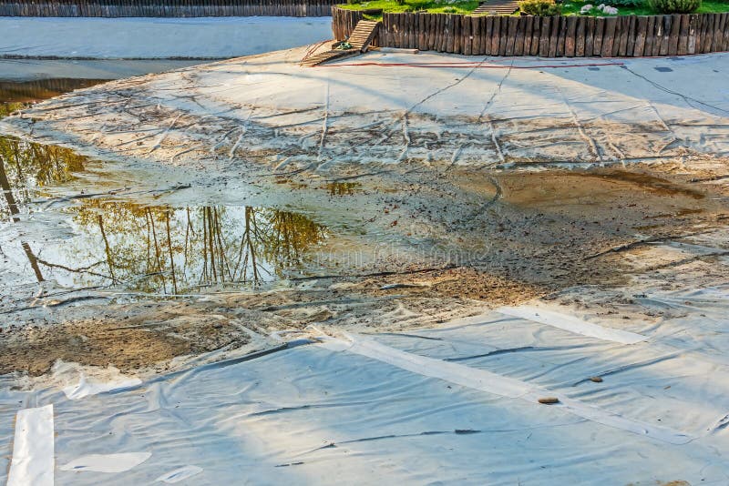 Dirt on the Bottom of a Garden Pond. Cleaning a Large Artificial Pond ...