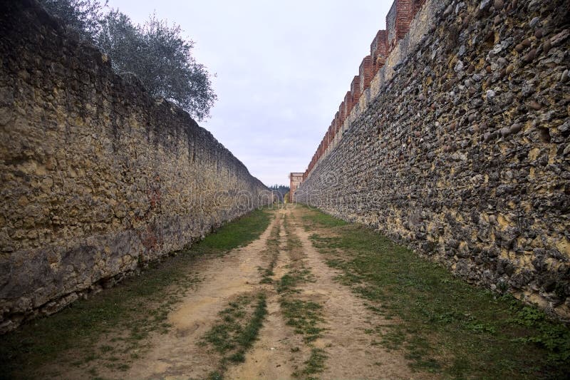 Dirt Path Bordered by Fortifications in a Park on a Cloudy Day Stock ...
