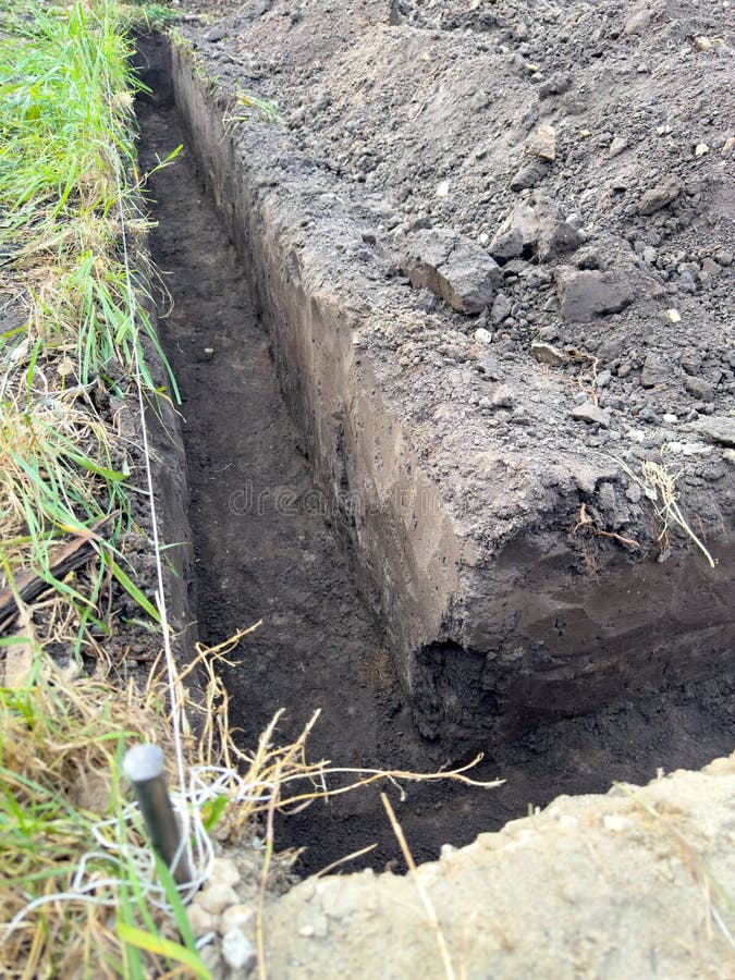 A Dirt Path is Dug Out in the Grass Stock Image - Image of water ...