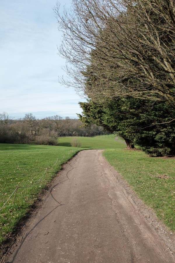 Dirt Path Winding through a Park with Green Grass on Either Side. Trent ...