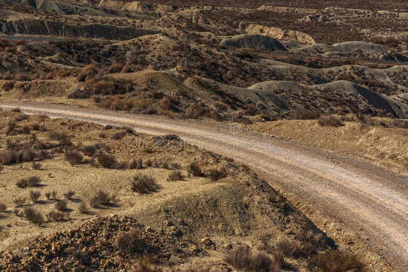 Dirt Road in Arid Desolate Landscape. Stock Image - Image of geology ...