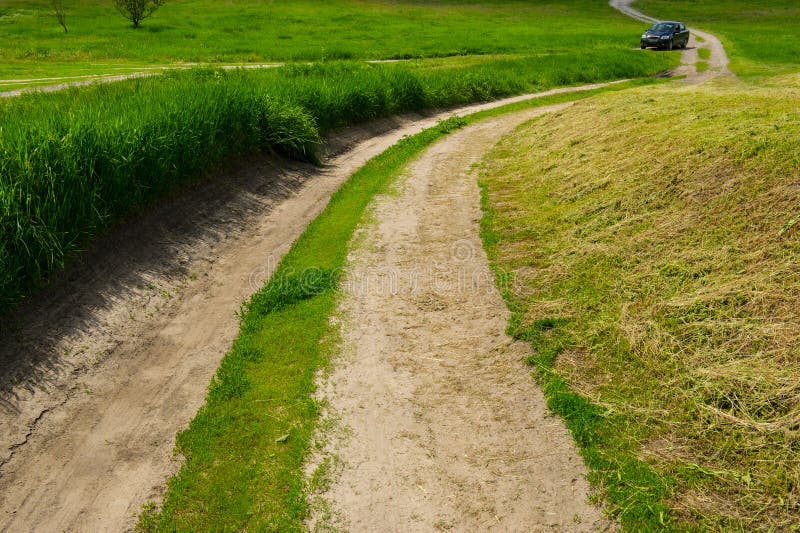 Dirt Road in the Field and the Car Stock Photo - Image of meadow ...
