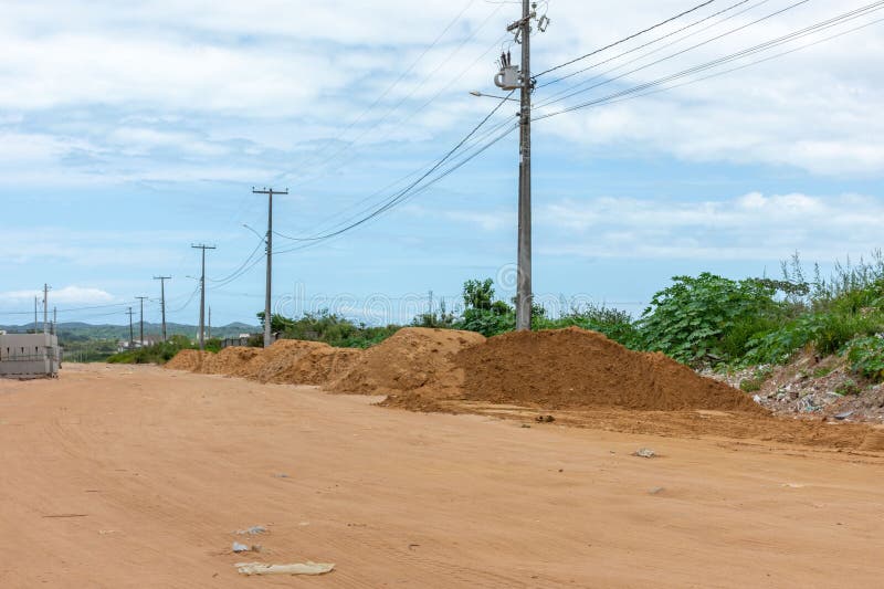 Dirt road with sand piles stock photo. Image of earthy - 360596798