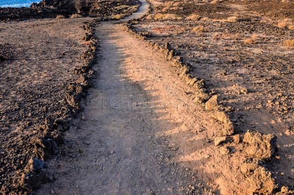 A Dirt Road with a Shadow on it Stock Photo - Image of dirt, shadow ...
