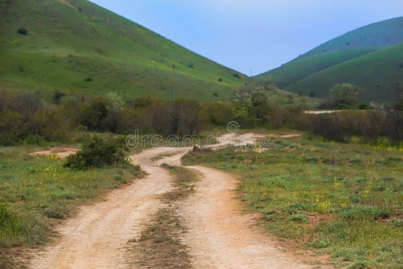 Dirt Road To the Open Mountain Range Stock Image - Image of hills ...