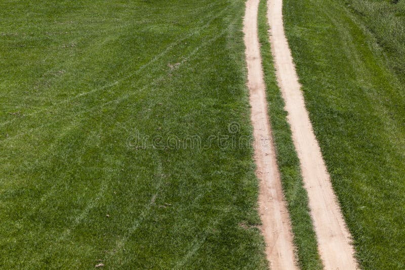 Dirt Road Tracks Field stock image. Image of grass, tractor - 27800299