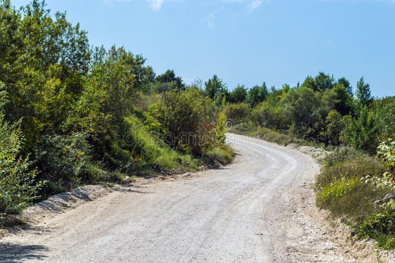 Dirt road turning left stock photo. Image of dirt, earth - 95080594