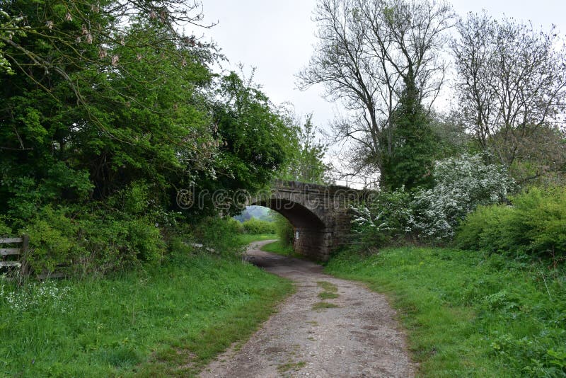 Dirt Walking Trail Passing Underneath a Bridge Stock Image - Image of ...