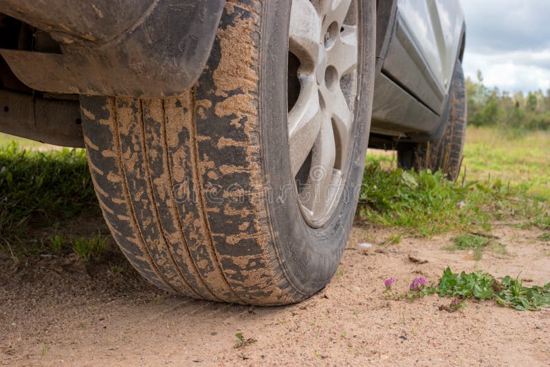 Dirty Car Tire with a Low Angle. Stock Photo - Image of grass, tires ...