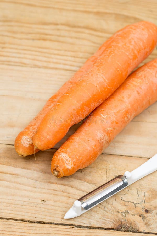 Dirty Carrots with Peeling Knife on the Wooden Table Stock Image ...