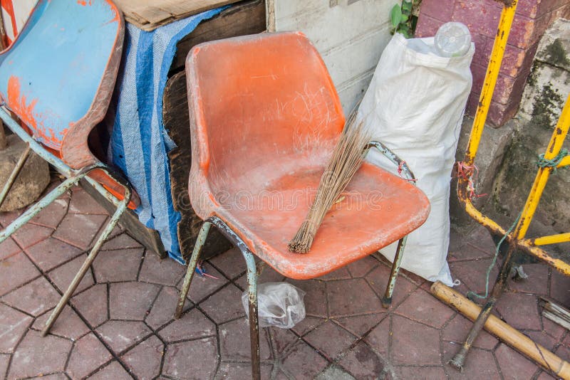 A Do Not Use Dirty Chair Sign on a Paper Towel on Green Chair in Corner ...