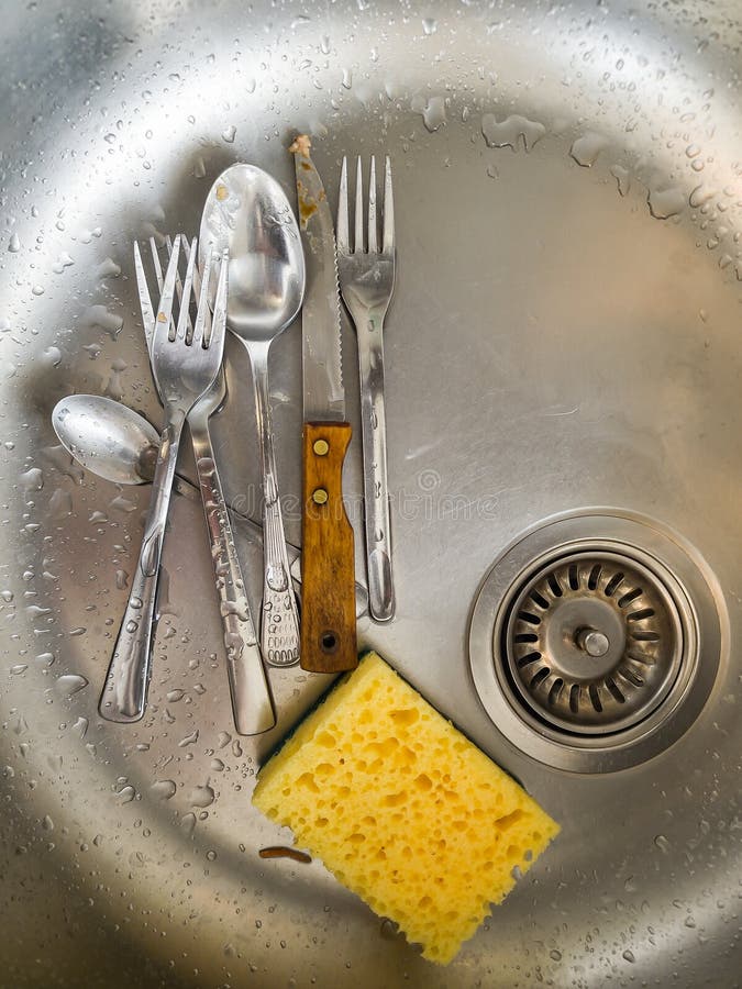 Dirty cutlery in the sink stock photo. Image of silverware - 246563872