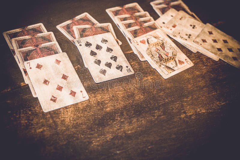 Dirty Deck of Playing Cards on the Wooden Table Stock Image - Image of ...