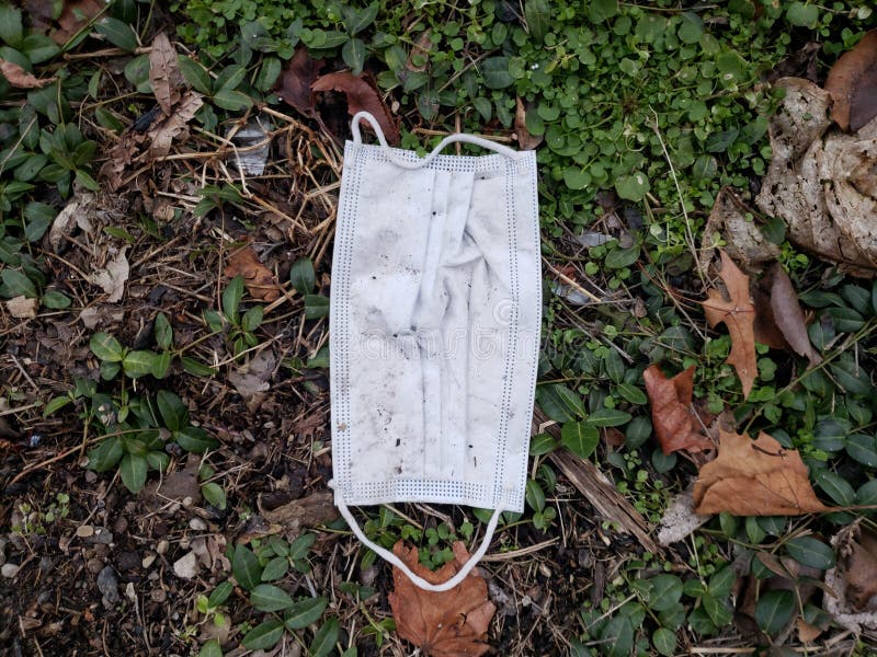 Dirty, Discarded Face Mask on the Ground Stock Image - Image of discard ...