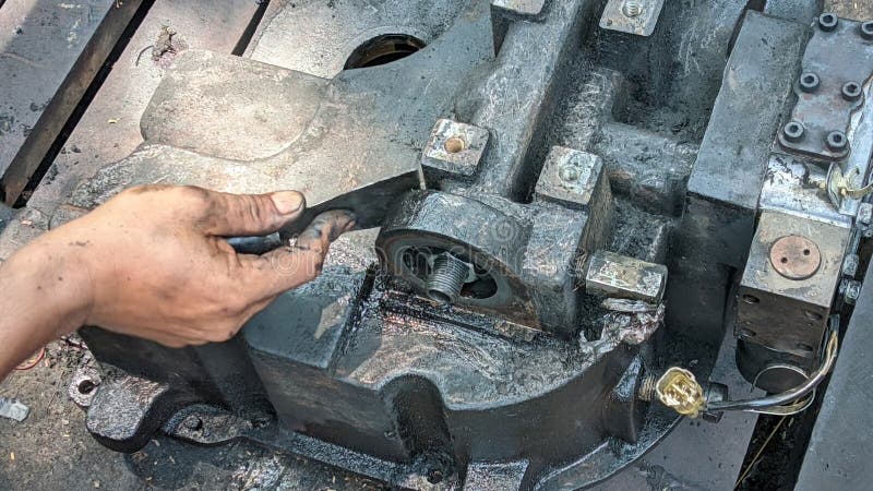 A Machine Being Cleaned by a Mechanic Stock Photo - Image of dirty ...