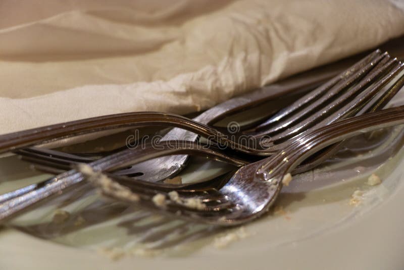 Dirty Forks on the Table after Dinner in a Restaurant Stock Photo ...