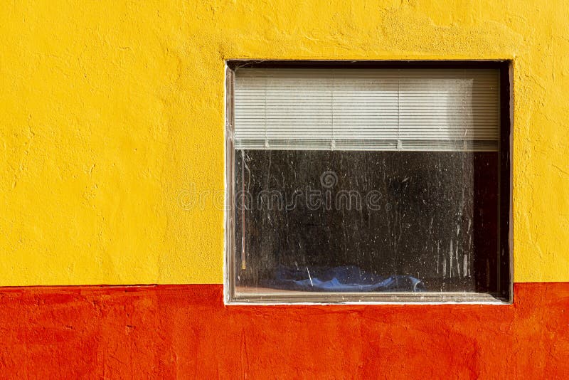 Dirty Glass Window on a Bright Red and Yellow Wall Stock Photo - Image ...