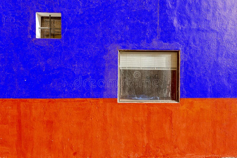 Dirty Glass Window on a Bright Red and Blue Wall Stock Image - Image of ...