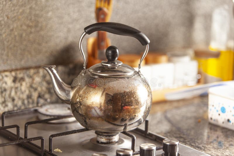 Dirty Kettle on a Gas Stove. Stock Photo - Image of plate, steel: 258156956